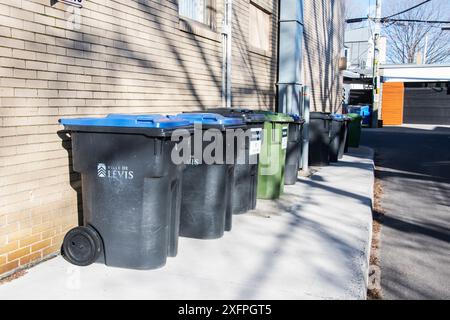 Wheelie garbage, recycling and organics bins at apartments on chem. du ...