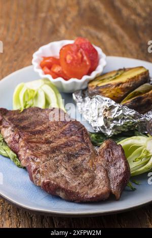 Grilled steak with jacket potato Stock Photo - Alamy