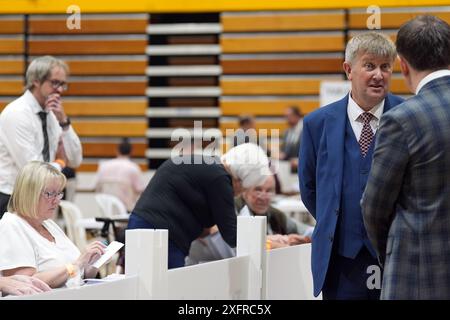 Agents from Reform UK look on as ballots are sorted at Clacton Leisure ...