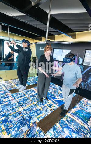 Youngsters bravely treading the VR Plank wearing virtual reality (VR ...