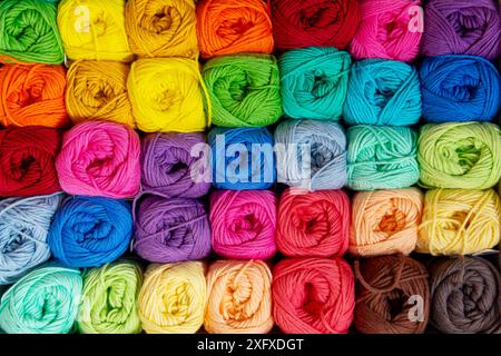 colorful wool threads for knitting on wooden background Stock Photo - Alamy