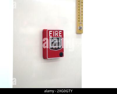 Fire bell pull sign in supermarket Stock Photo - Alamy