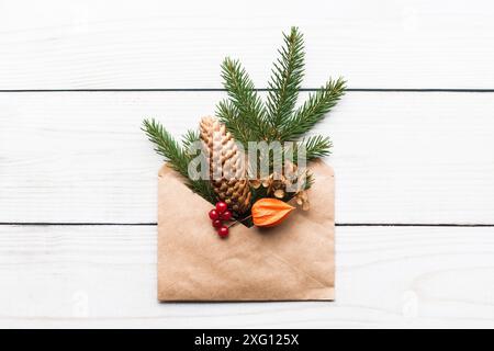 Christmas tree branch cone flowers decoration in paper envelope on ...