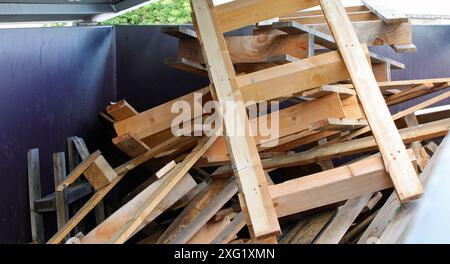 industrial waste container filled with wooden pallets ready for ...