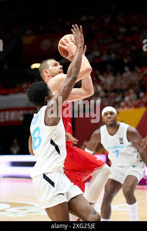 Michal Sokolowski from Poland team, Buddy Hield from Bahamas team seen ...