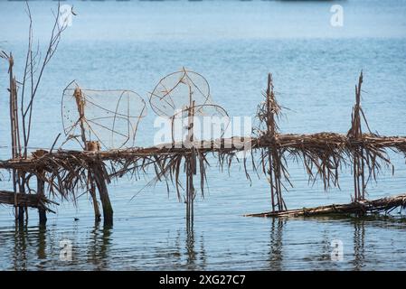 Reed fish traps and metal cages a typical method of fishing along the ...
