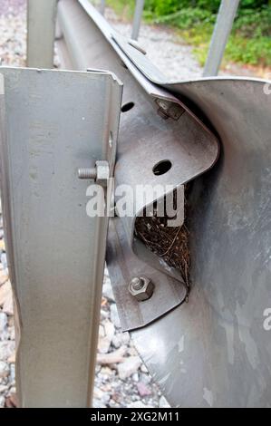 Back side of a highway guardrail with a steel cable Stock Photo - Alamy