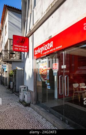 Telepizza store sign and shingle showing scooter delivery service ...