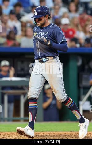 Tampa Bay Rays outfielder Josh Lowe throws after fielding a single from ...