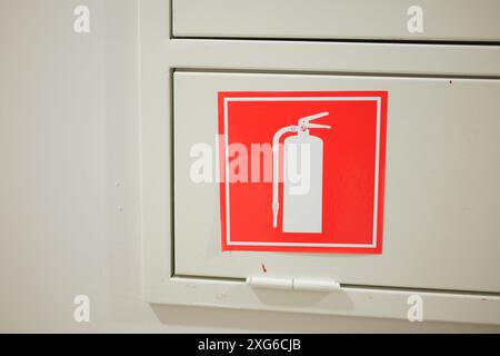 The store aisle is marked with a sign indicating the presence of a fire ...