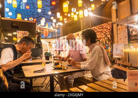 Osaka, Japan - People eating outdoor in Dotonbori Stock Photo - Alamy