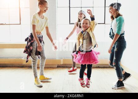 cute preteen girl hip hop dancer with cool attitude posing in studio ...
