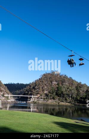A chain of chair lifts crossing a lake with the Alexandra suspension ...