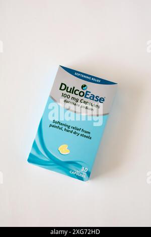 Docusate sodium soft gel capsules in orange container with SWALLOW ...