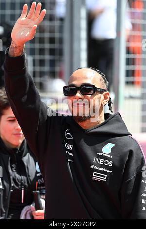 Mercedes' Lewis Hamilton waves to the Silverstone crowd during the ...