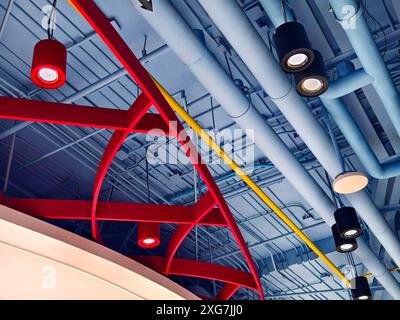 Ceiling with pipes and lights in creates industrial a pattern Stock ...