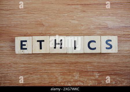 ETHICS alphabet letters top view on wooden background Stock Photo - Alamy