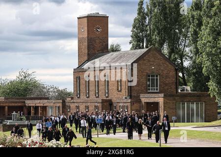 Mourners leave the chapel at Pontefract Crematorium during Rob CBE ...