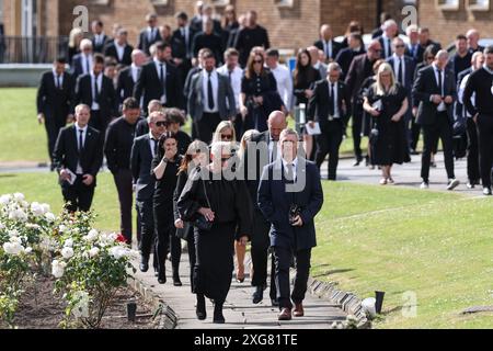 Mourners leave the chapel at Pontefract Crematorium during Rob CBE ...