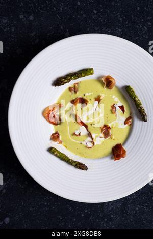 Asparagus soup with crispy iberic ham Stock Photo - Alamy