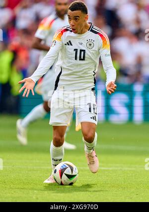 Jamal Musiala #10 of Germany drives the ball forward during the 2026 ...
