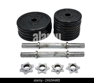 Detail of a screw-on dumbbell kit with metal weight plates on a white ...