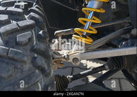ATV rear suspension springs and shock absorbers 2 Stock Photo - Alamy
