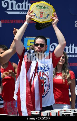 Professional competitive eater Patrick Bertoletti consumes 58 hot dogs ...