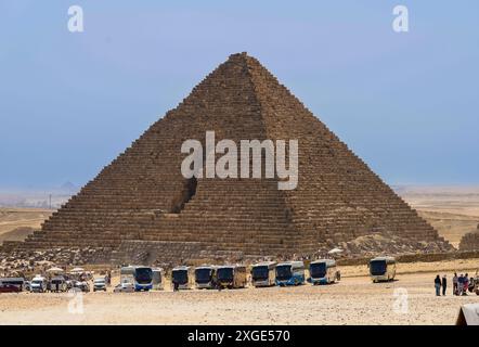 Tourist buses line up at one of the pyramids along the Giza Plateau ...