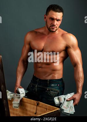 Investment concept. Bearded succesful bodybuilder with money dollar ...