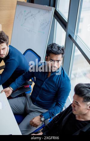 Focus on the results. a group of colleagues having an office meeting ...