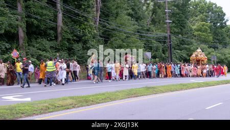 In Connecticut., devotees from the Wilton Hindu Mandir pull a very ...