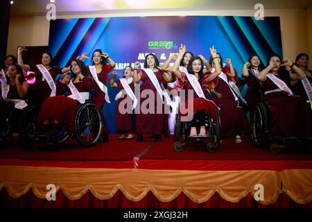 Kathmandu, Nepal. 09th July, 2024. A woman with disabilities puts on ...