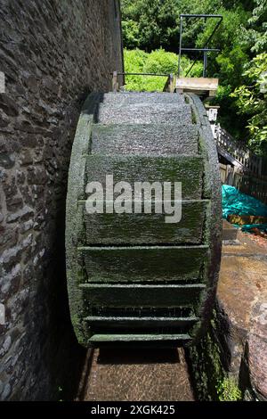 The River Avill water mill with a wooden mill wheel at Dunster Castle ...