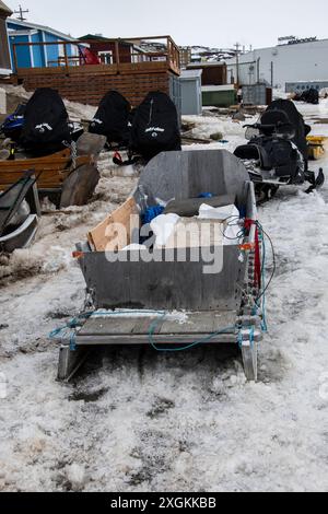Qamutiik traditional Inuit sleds stored on the beach on Frobisher Bay ...