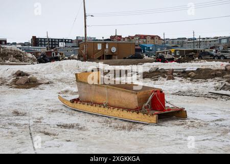 Qamutiik traditional Inuit sleds stored on the beach on Frobisher Bay ...