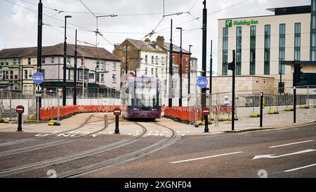 Tram emerging from the North station Holiday Inn interchange in central ...