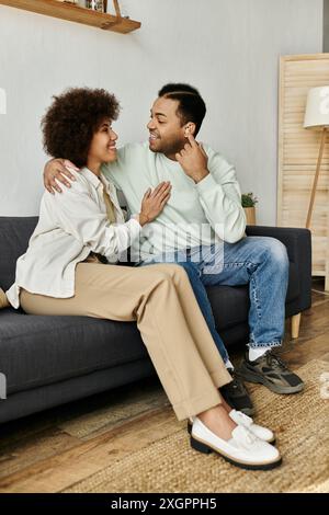 An attractive African American couple communicates using sign language ...
