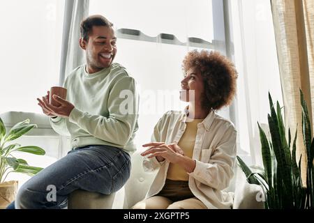 An African American couple communicates through sign language while ...