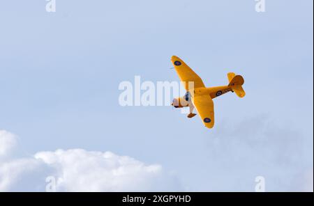 Stinson Reliant aircraft 1942 in royal navy yellow colours flying Stock ...