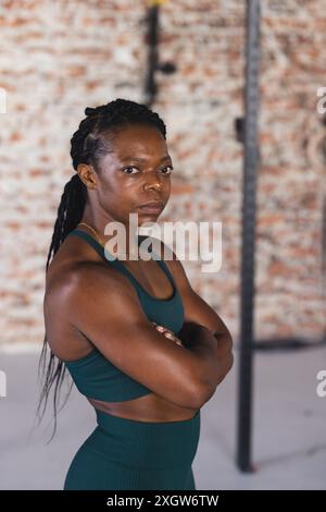 Strong female athlete poses with determination, embodying power and ...