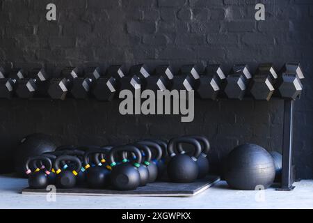 A well-equipped gym corner with various weights, with copy space ...