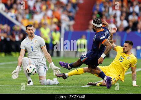 Andrei Burca, Denzel Dumfries seen during UEFA Euro 2024 Round of 16 ...
