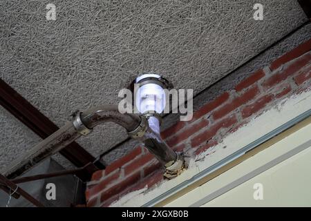 Old ceiling mounted glass drain, vent, pipes in school science room or ...
