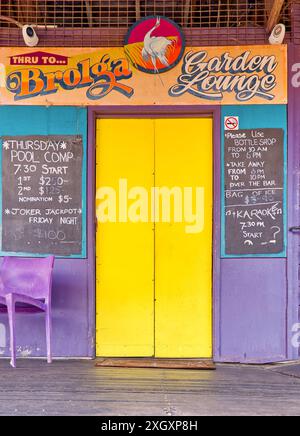 Close up image of exterior of Normanton Purple Pub hotel with chair ...