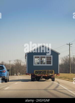 Oversize load. Manufactured house transported on the highway. Mobile ...