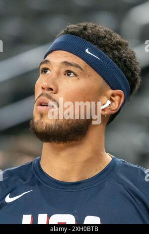 Phoenix Suns guard Devin Booker (1) shoots as Utah Jazz forward Royce O ...