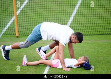Novak Djokovic and his daughter Tara on day eleven of the 2024 ...