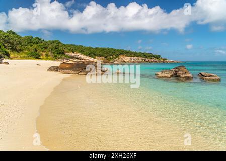Picturesque tropical golden sandy Sunset Beach with turquoise water on ...