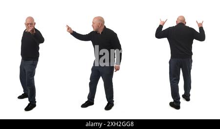 serious man showing the horns symbol on red background Stock Photo - Alamy